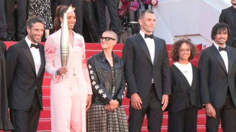 Olympic Flame Ascends Cannes Steps for Paris 2024 - NOW | News Of the World